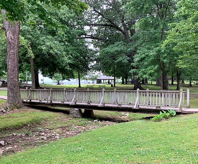 This charming wooden bridge isn't just crossing a creek&mdash;it's connecting you to the simpler pleasures of a Kentucky afternoon stroll.