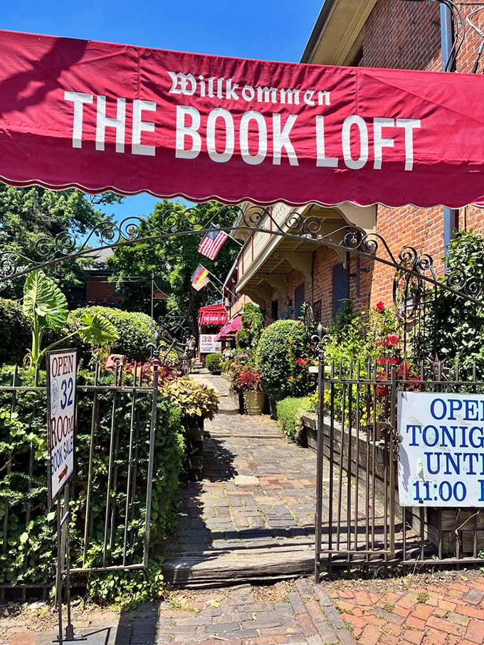 The entrance garden path feels like stepping into a secret world where books, not flowers, are the main attraction.