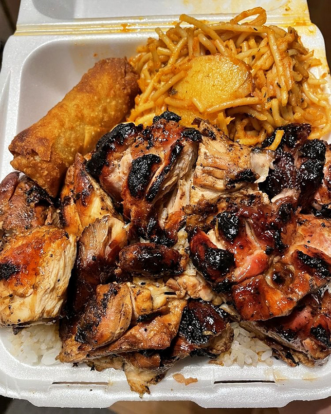 A mountain of bourbon chicken with noodles and an egg roll. This isn't just a meal&mdash;it's a commitment to happiness.