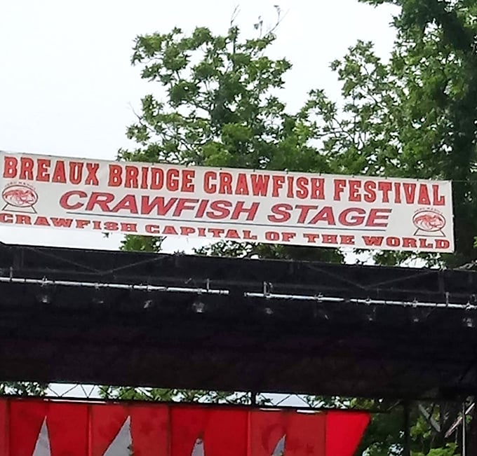 The Crawfish Stage banner proudly announces Breaux Bridge's status as the undisputed "Crawfish Capital of the World"&mdash;a title they take very seriously.