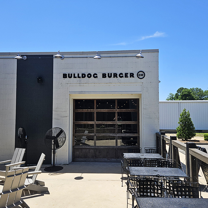 Bulldog Burger's industrial-chic patio beckons with the promise of handcrafted patties. Their garage-door facade opens to reveal culinary creativity without pretension.