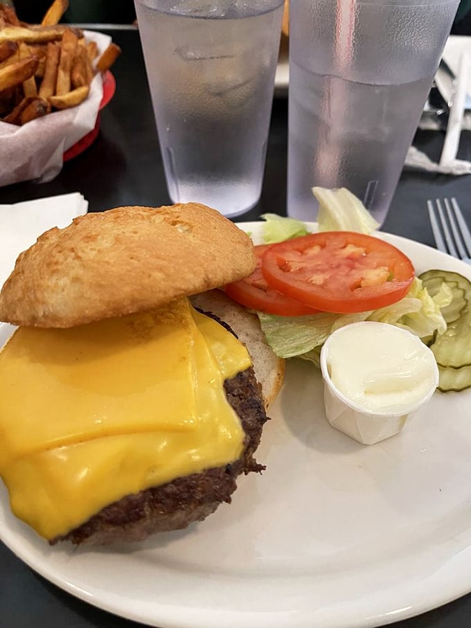 A California cheeseburger that doesn't need avocado to prove its worth—just fresh veggies, melted cheese, and a perfectly toasted bun.