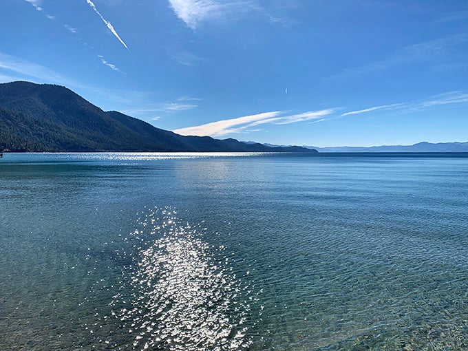 Water so clear and calm it looks Photoshopped, except it's just Lake Tahoe being ridiculously beautiful on a Tuesday.