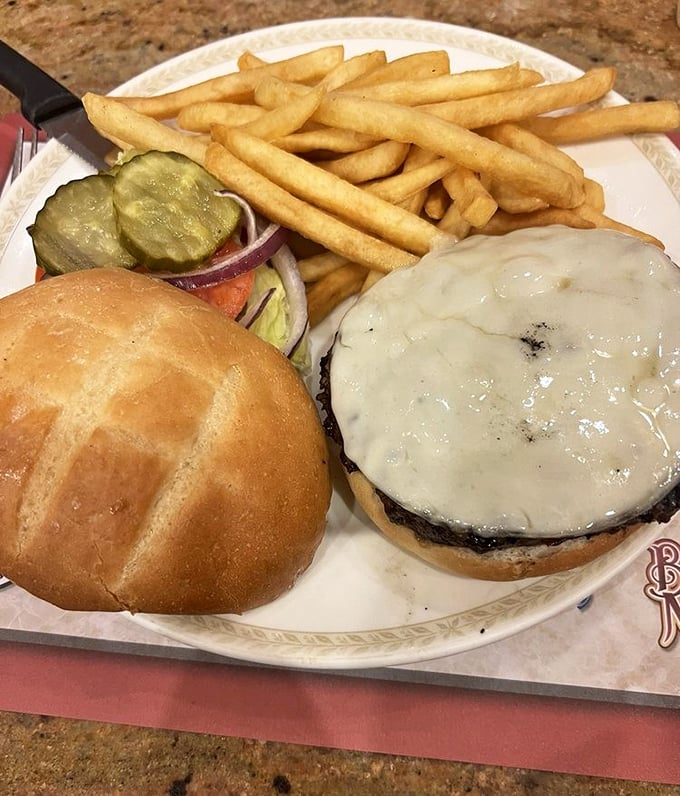 A cheeseburger that understands its purpose in life: to satisfy hunger without pretension, accompanied by fries that actually taste like potatoes.