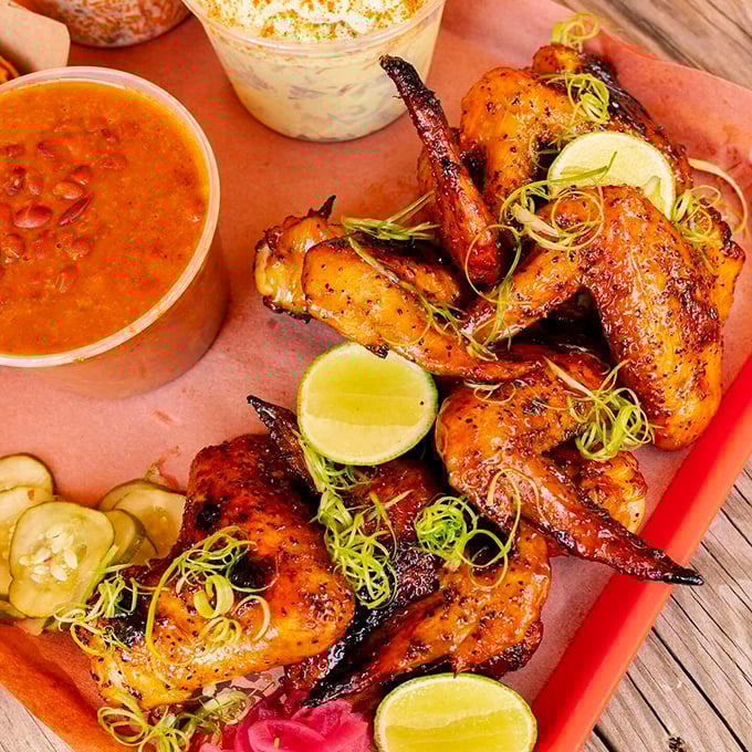 These aren't just wings; they're flavor ambassadors with crispy skin passports, stamped with lime and garnished with adventure.