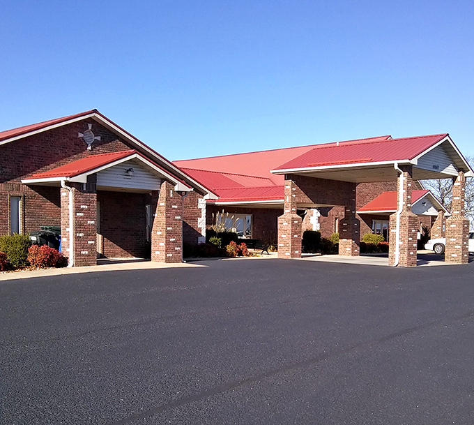 Even modern conveniences like this brick-columned structure maintain a certain architectural dignity that complements the town's more historic elements.