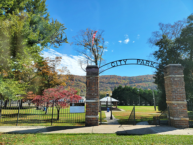 Fort Payne's City Park entrance frames the perfect view of autumn mountains, where seasonal colors paint the backdrop for community gatherings.