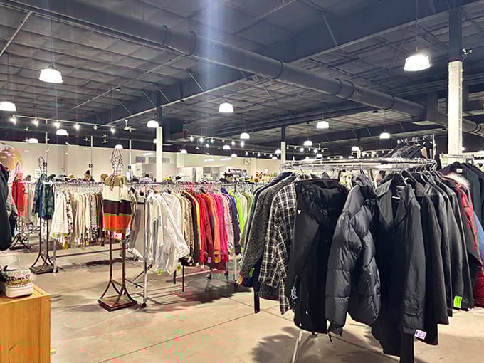 Winter coats huddle together on racks like penguins, waiting for someone to take them home when the Pennsylvania chill returns.