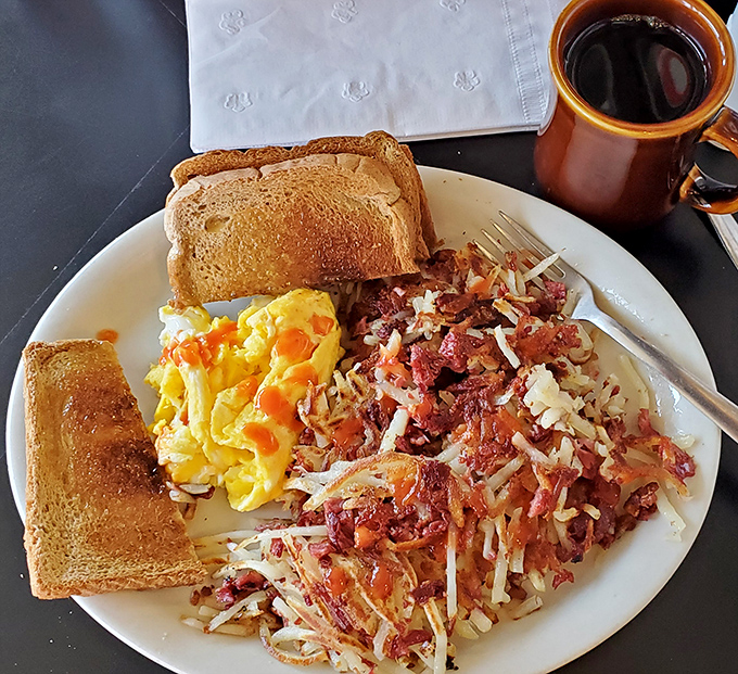 Corned beef hash that doesn't mess around &ndash; crispy, savory, and paired with eggs that look like they just posed for their glamour shot.