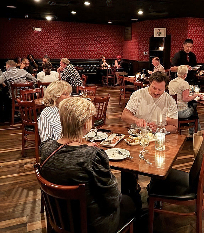 The dining room hums with the universal language of satisfaction—forks pausing mid-air as diners take that first transcendent bite of perfectly cooked beef.