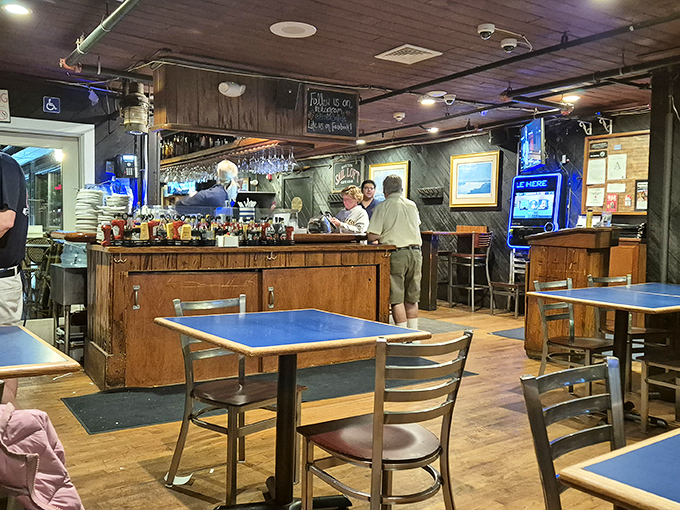 The bar area: where locals and tourists unite in the universal language of "please pass the oyster crackers." Maritime d&eacute;cor that feels earned, not manufactured.