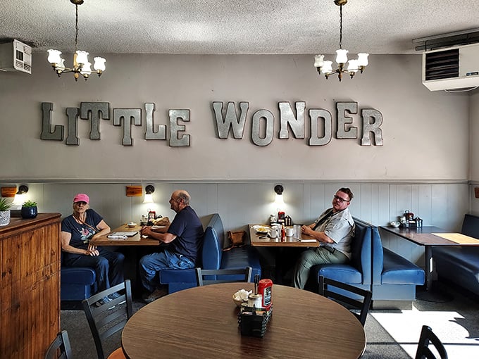 Sunlight streams through windows onto diners enjoying unhurried meals, where nobody's scrolling phones instead of talking.