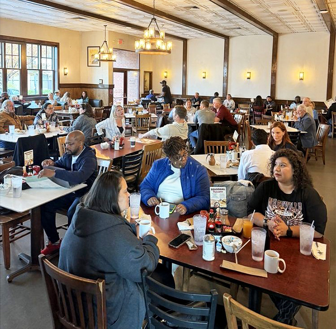 A full house of happy diners, each experiencing their own personal pancake epiphany. The buzz of satisfaction is almost as thick as the syrup.