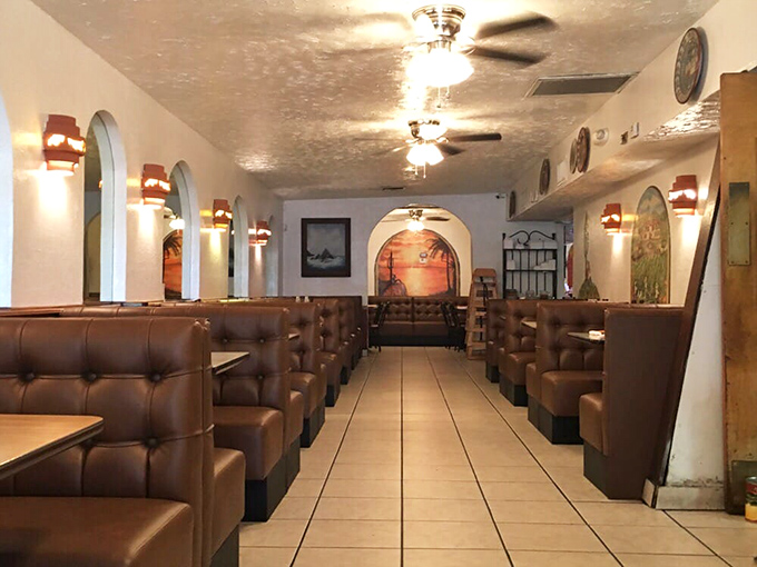 The dining room's warm lighting and cozy booths create the perfect backdrop for the serious business of enchilada appreciation.