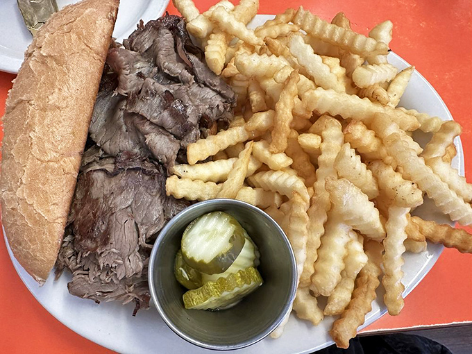 A French dip sandwich with crispy fries and pickles&mdash;proof that lunch at a breakfast joint can be just as satisfying as the morning offerings.