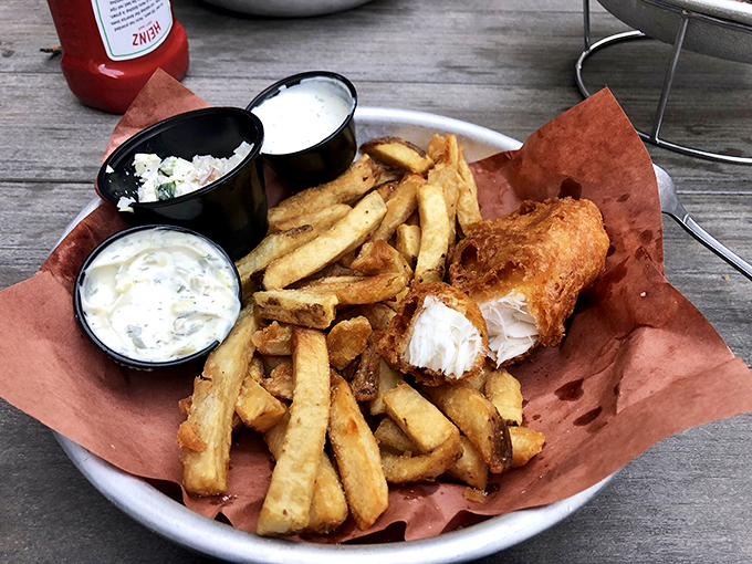 Beer-battered fish so crisp it practically shatters, alongside hand-cut fries that deserve their own fan club. The holy grail of fish and chips.