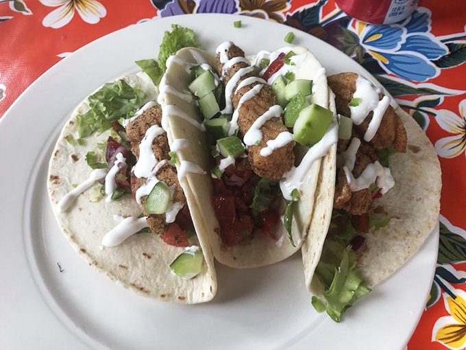 Fish tacos that bring a splash of coastal flair to inland Maine. The drizzle of sauce is like the perfect punchline to a delicious joke.