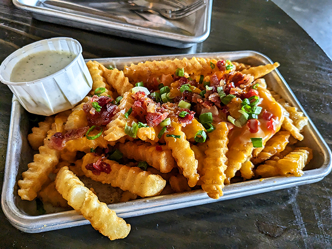 These loaded fries aren't just a side &ndash; they're the main event, dressed for success with bacon, cheese, and green onions.