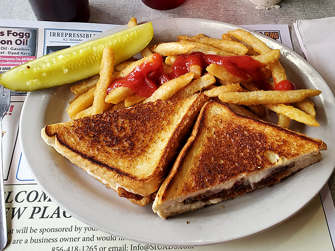 The grilled cheese &ndash; golden-brown perfection with that ideal cheese pull, accompanied by fries that somehow taste better when ketchup is applied directly on top.