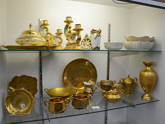 Gold-toned treasures gleam under display lights, transforming ordinary shelves into what looks like King Midas's personal collection.