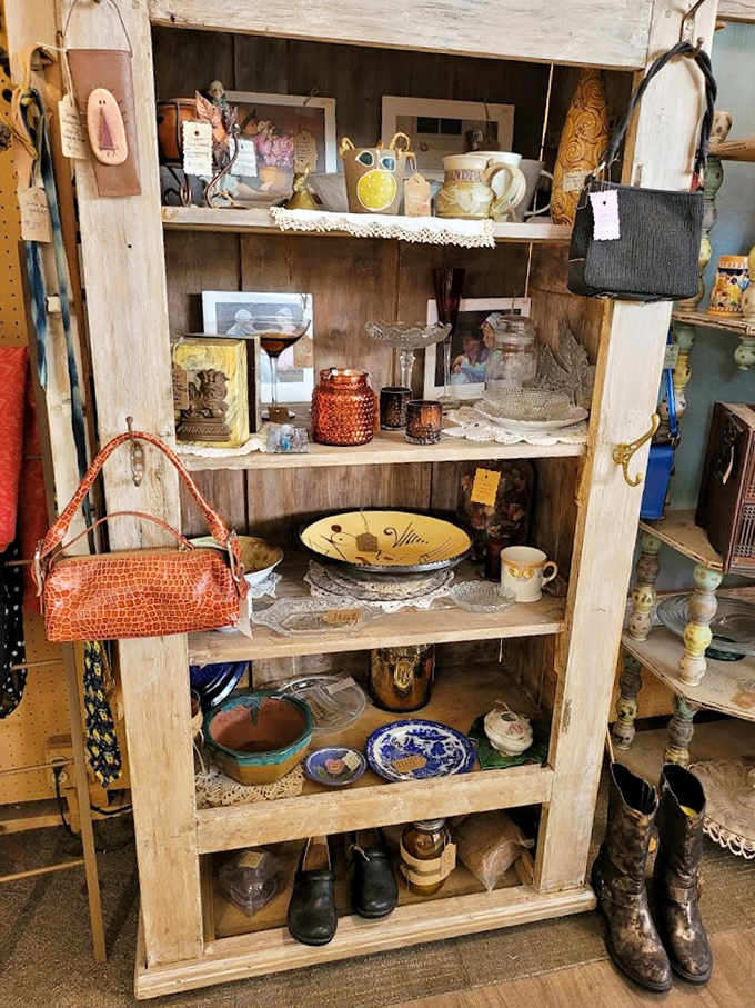 A rustic cabinet showcasing treasures that once graced grandma's china hutch. Those blue willow plates have probably served more Sunday dinners than I've had hot breakfasts.