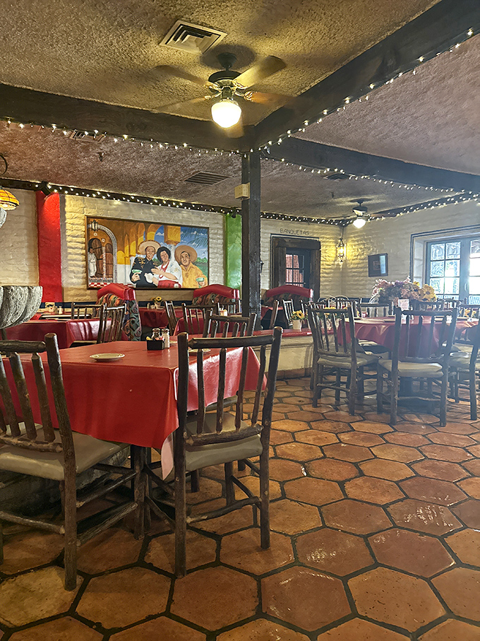 Red tablecloths and rustic wooden chairs set against terracotta floors&mdash;this dining room feels like your Mexican grandmother's house, if you had one.