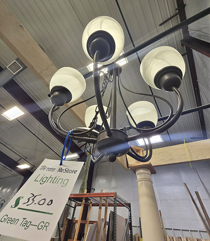 For just $5, this chandelier could be casting dramatic shadows in your dining room instead of hanging here like a well-dressed wallflower at the dance.