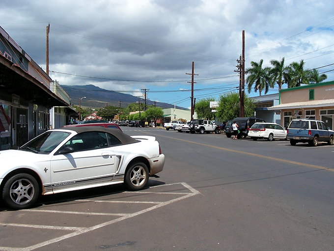 Main Street stretches toward distant mountains, a single-lane snapshot of island life without the tourist crowds.
