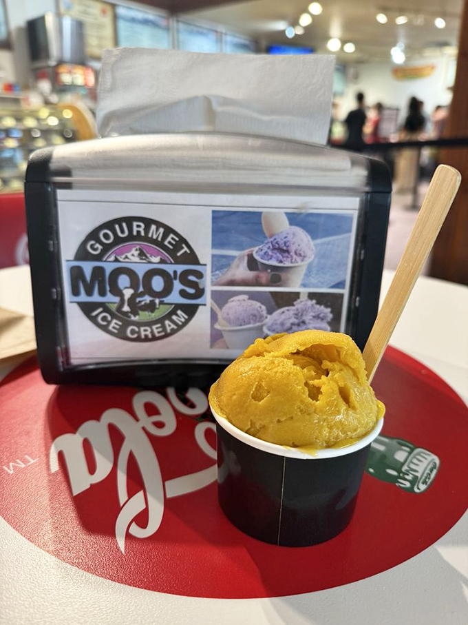 Sunshine-yellow mango sorbet sitting proudly on its throne&mdash;a tropical vacation in a cup while surrounded by mountain majesty.
