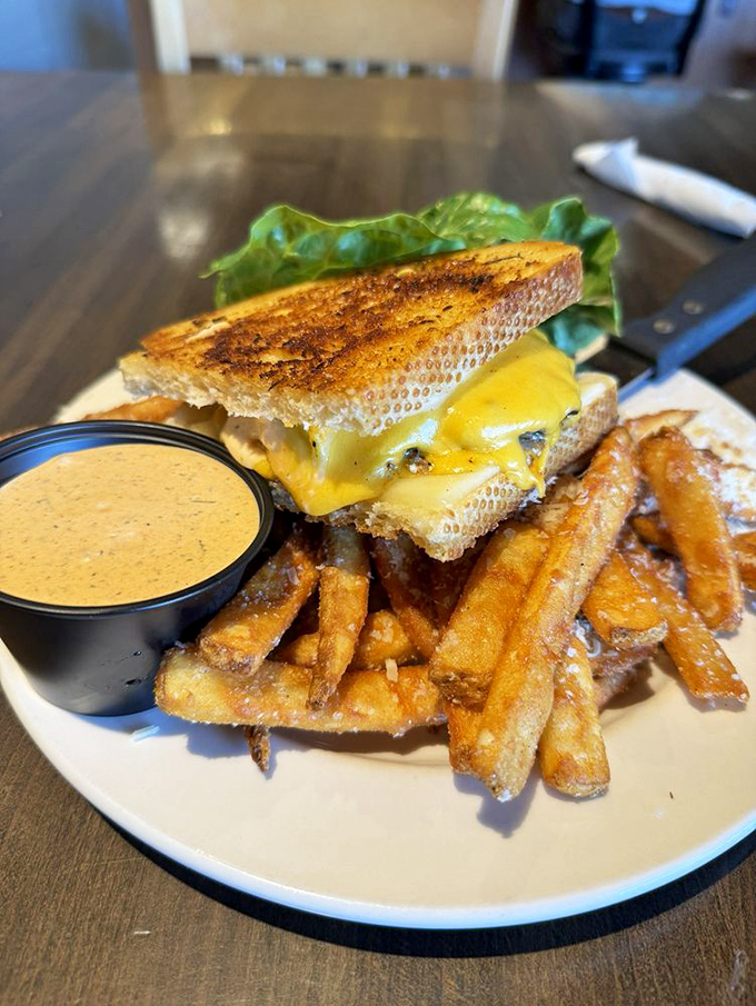 The grilled cheese that graduated with honors. Paired with golden fries and special sauce, it's childhood comfort food that grew up but didn't lose its soul.