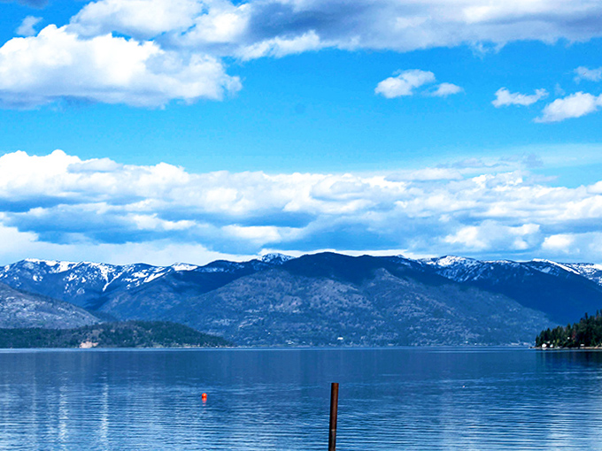 Snow-capped peaks create the perfect backdrop for Lake Pend Oreille's impossibly blue waters. Nature's version of a screensaver that you can actually visit.