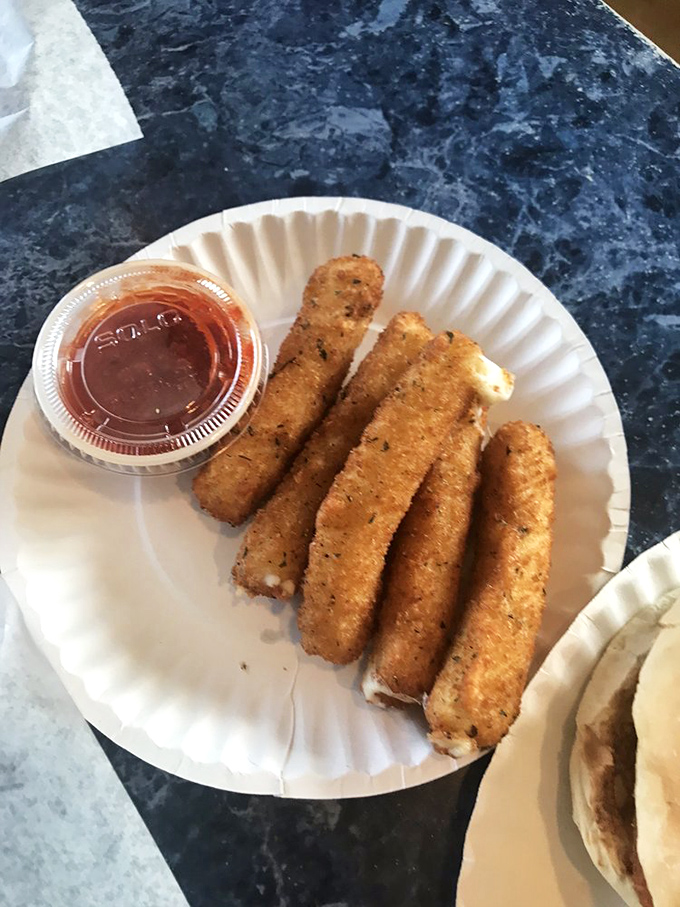 Mozzarella sticks: the universal language of comfort. Crispy outside, molten inside, with marinara for dipping&mdash;some traditions need no improvement.