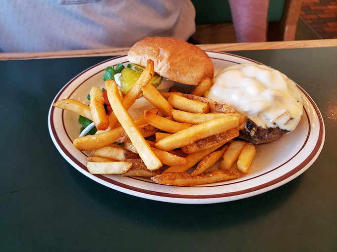 A burger that doesn't need Instagram filters to look good. Those fries standing at attention like they know they're part of something important.