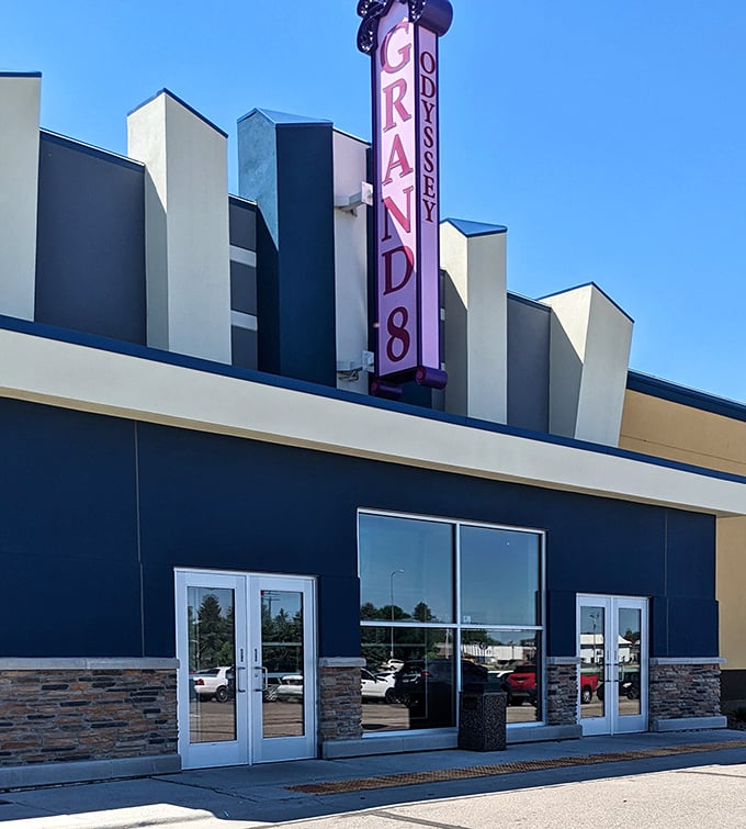 The Grand 8 Theater's vintage sign promises entertainment escape without big-city prices. Movies taste better with small-town popcorn—that's just science.