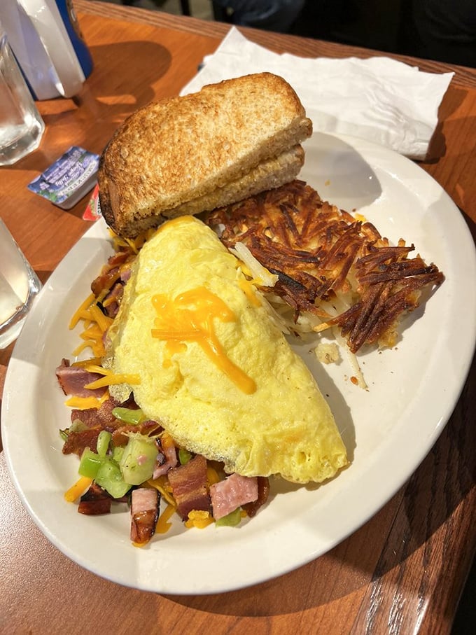This omelet doesn't just contain ingredients&mdash;it showcases them. Paired with crispy hash browns and toast, it's the breakfast equivalent of a standing ovation.