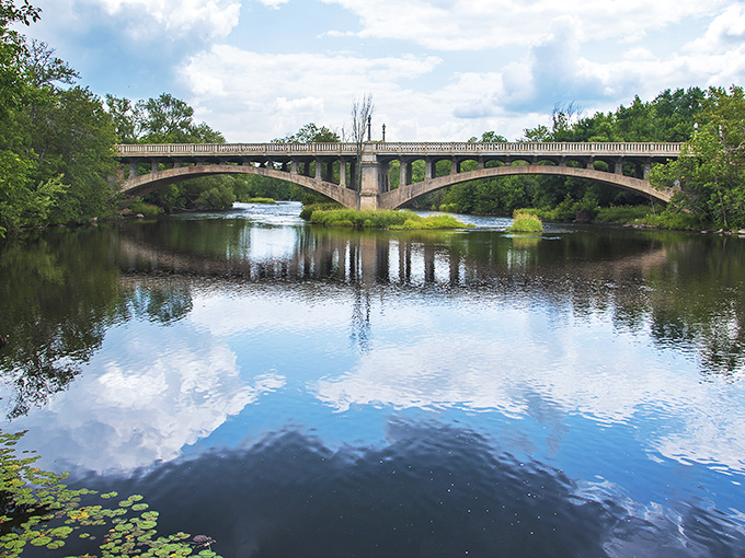 The Paint River Bridge creates perfect symmetry with its reflection, proving that sometimes the most beautiful views are the ones hiding in plain sight.
