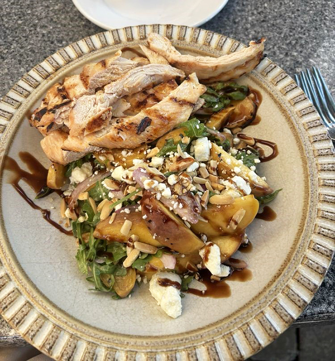 A summer salad that proves vegetables can be the main event&mdash;grilled peaches, greens, and goat cheese creating a perfect harmony on the plate.
