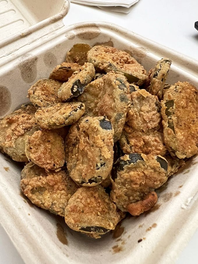 These pickle chips have achieved the impossible: maintaining their tangy personality while donning a perfectly crispy coating. A study in delicious contrasts.