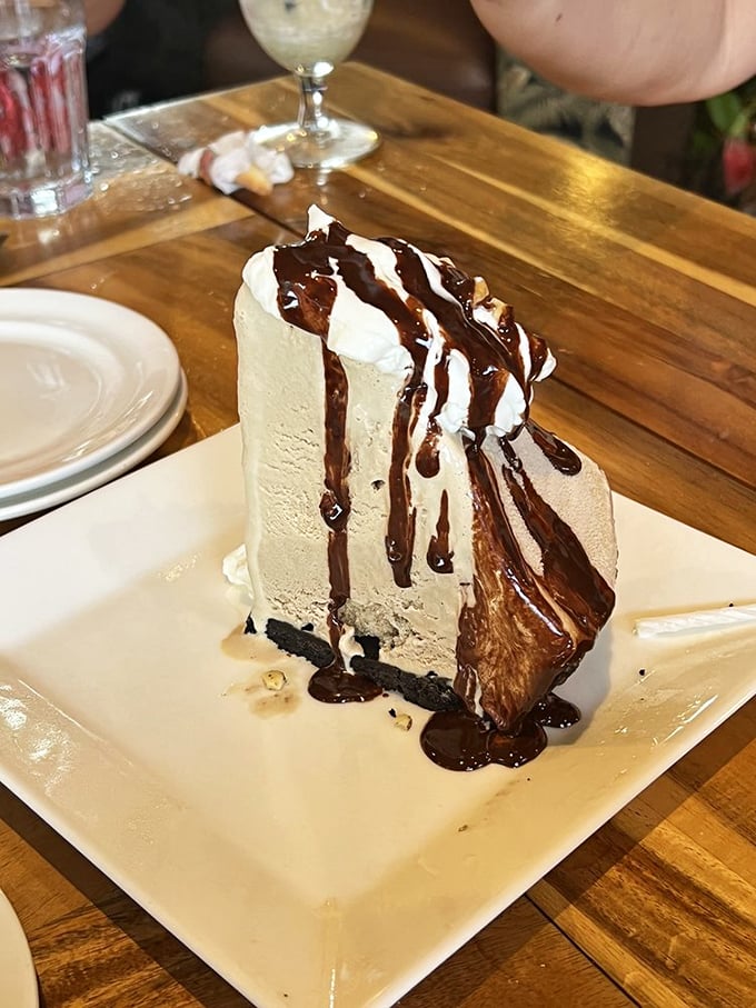 A dessert that understands the importance of dramatic presentation. This towering slice of heaven proves gravity is merely a suggestion when it comes to pie.