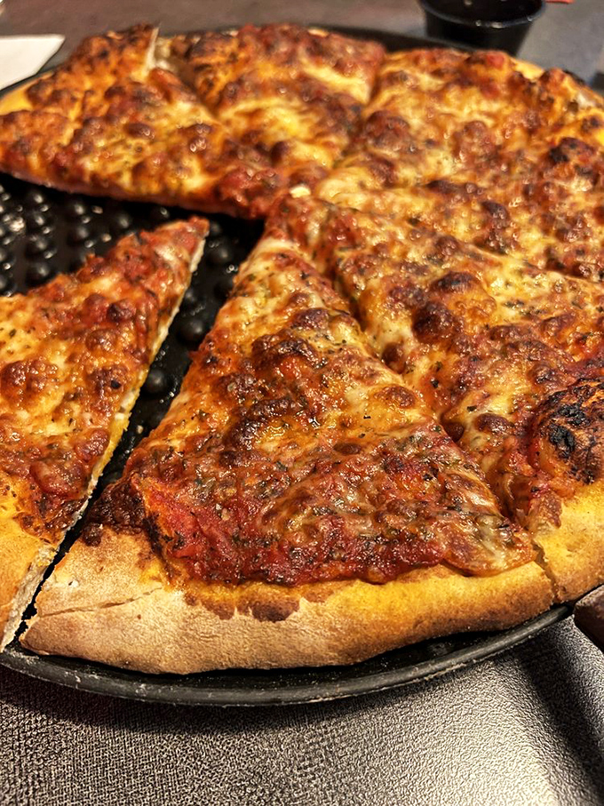 Pizza with a crust that's achieved that perfect balance between chewy and crisp. The cheese bubbles tell stories of proper brick-oven heat.