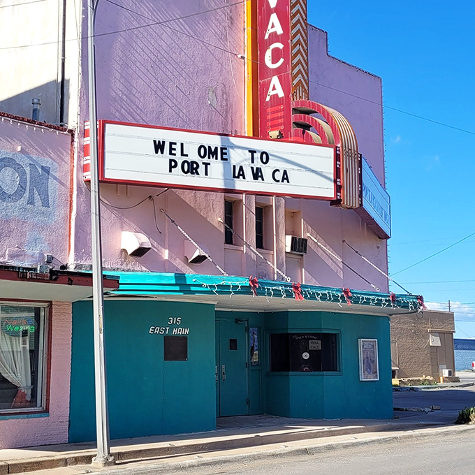 "Welcome to Port Lavaca" indeed&mdash;where the marquee is honest, the theater is pink, and nobody's checking their phone during the show.
