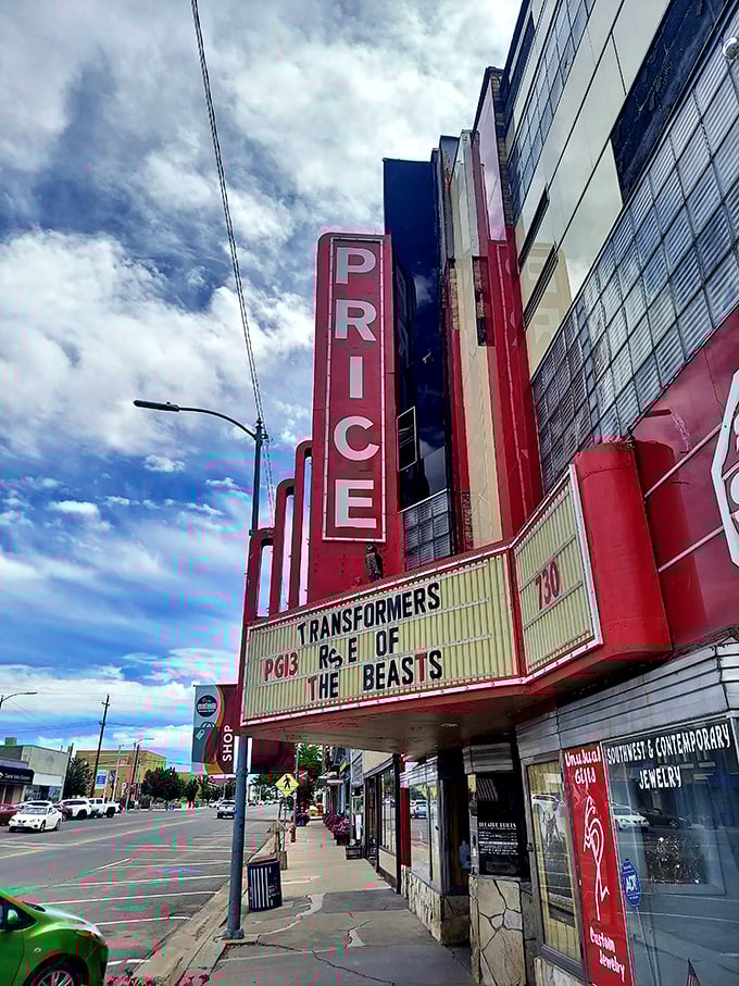 The Price Theatre's neon marquee glows like a beacon of nostalgia, promising movie magic in an era before streaming services conquered our couches.