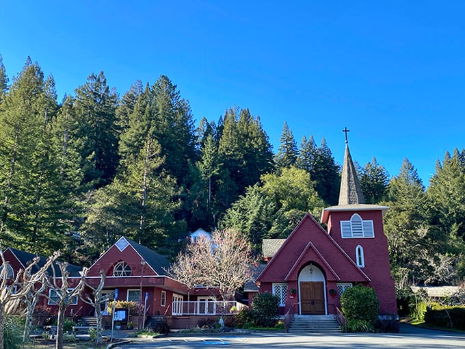 The brick-red church stands as Occidental's architectural ruby, its warm tones complementing the surrounding emerald forest.