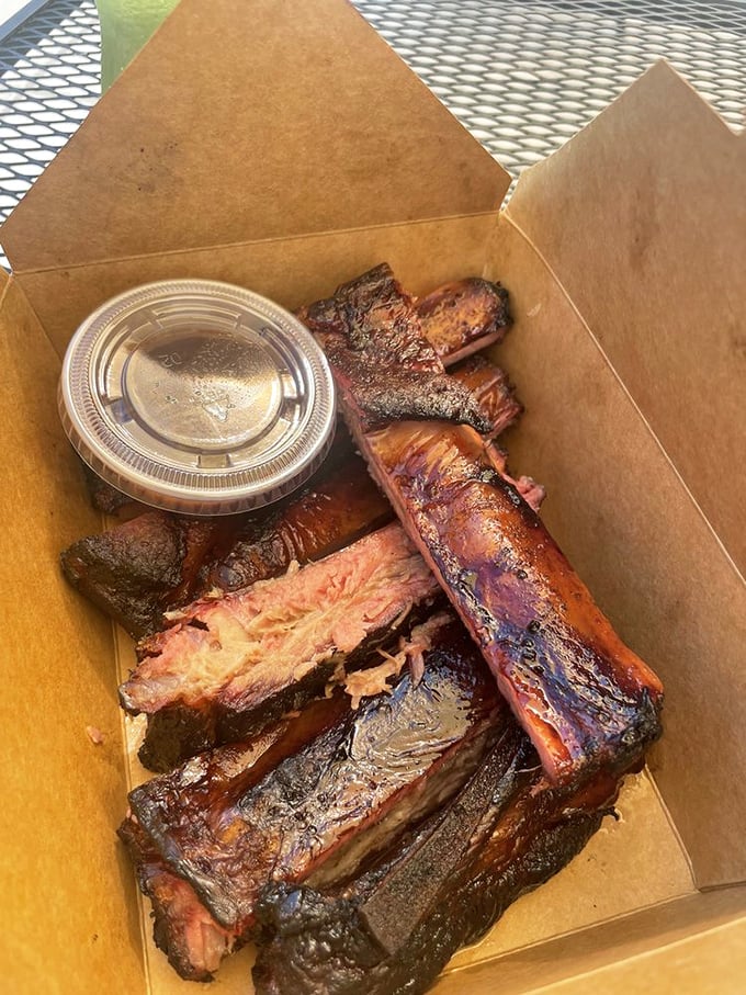 Ribs so perfectly smoked they're practically falling off the bone before you even touch them. The sauce cup is just a formality.