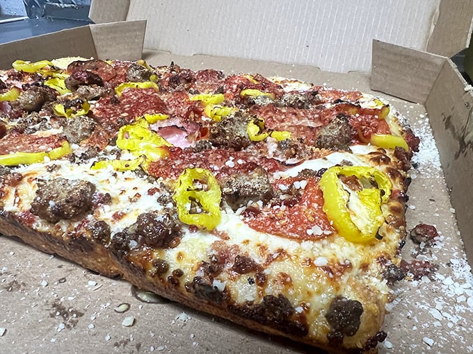 This Sicilian slice has more layers than an Oscar-winning drama, with a supporting cast of pepperoni and banana peppers stealing every scene.