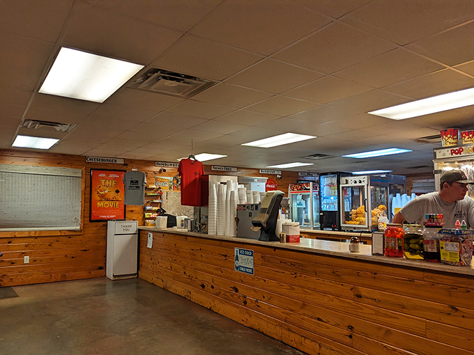 The heart of any drive-in: a concession stand with wood-paneled warmth serving up buttery popcorn and childhood memories by the handful.