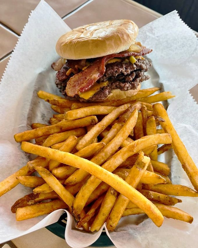This triple cheeseburger with bacon isn't just a meal&mdash;it's a commitment, a challenge, and possibly the best decision you'll make all week.