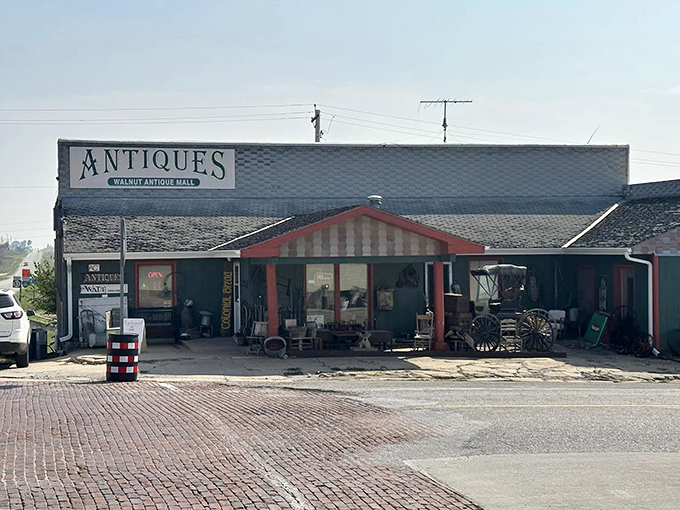 The Walnut Antique Mall promises treasures inside that rustic exterior, like a weathered jewelry box holding grandmother's diamonds.