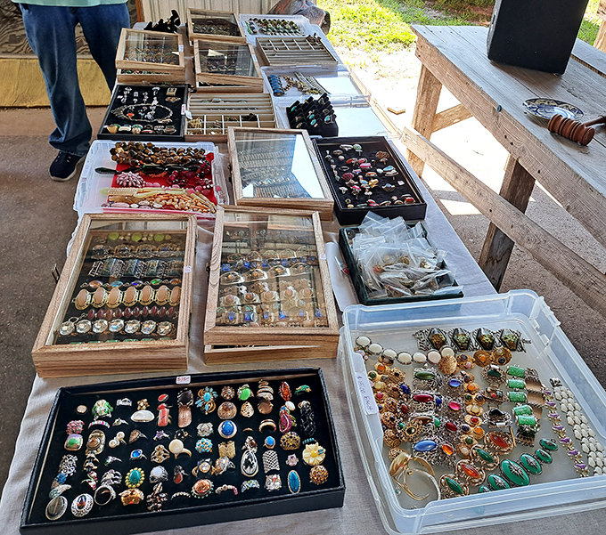 Jewelry displays transform ordinary tables into treasure chests of possibility. Each tray contains someone's future heirloom or conversation starter.