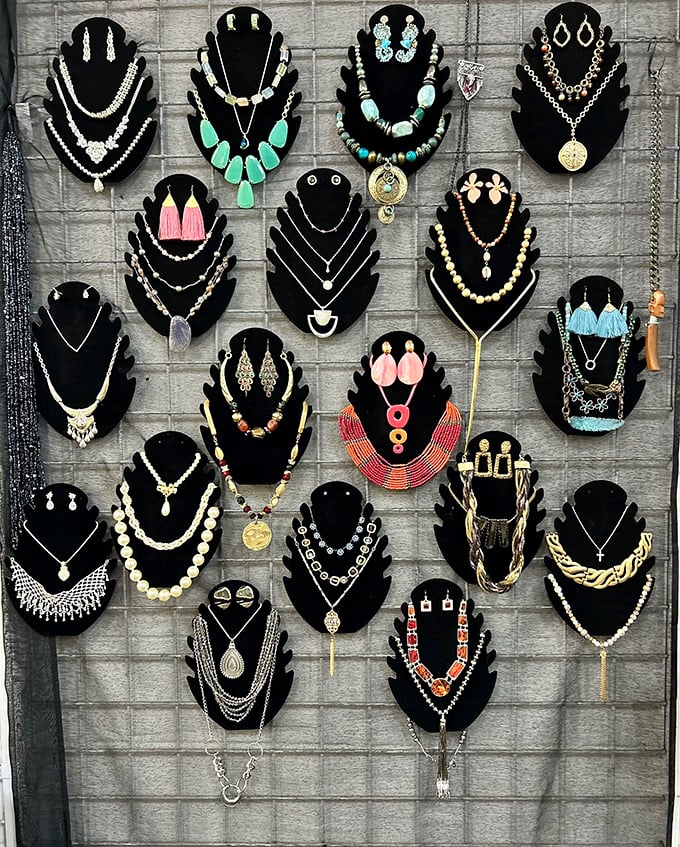 This jewelry display transforms humble black velvet into a gallery of personal expression, where someone's past statement piece awaits your future outfit.
